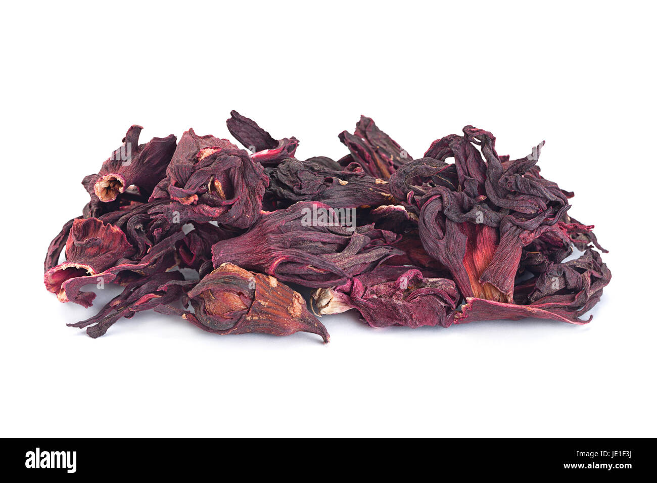 Hibiscus red dry tea closeup isolated on white background Stock Photo ...