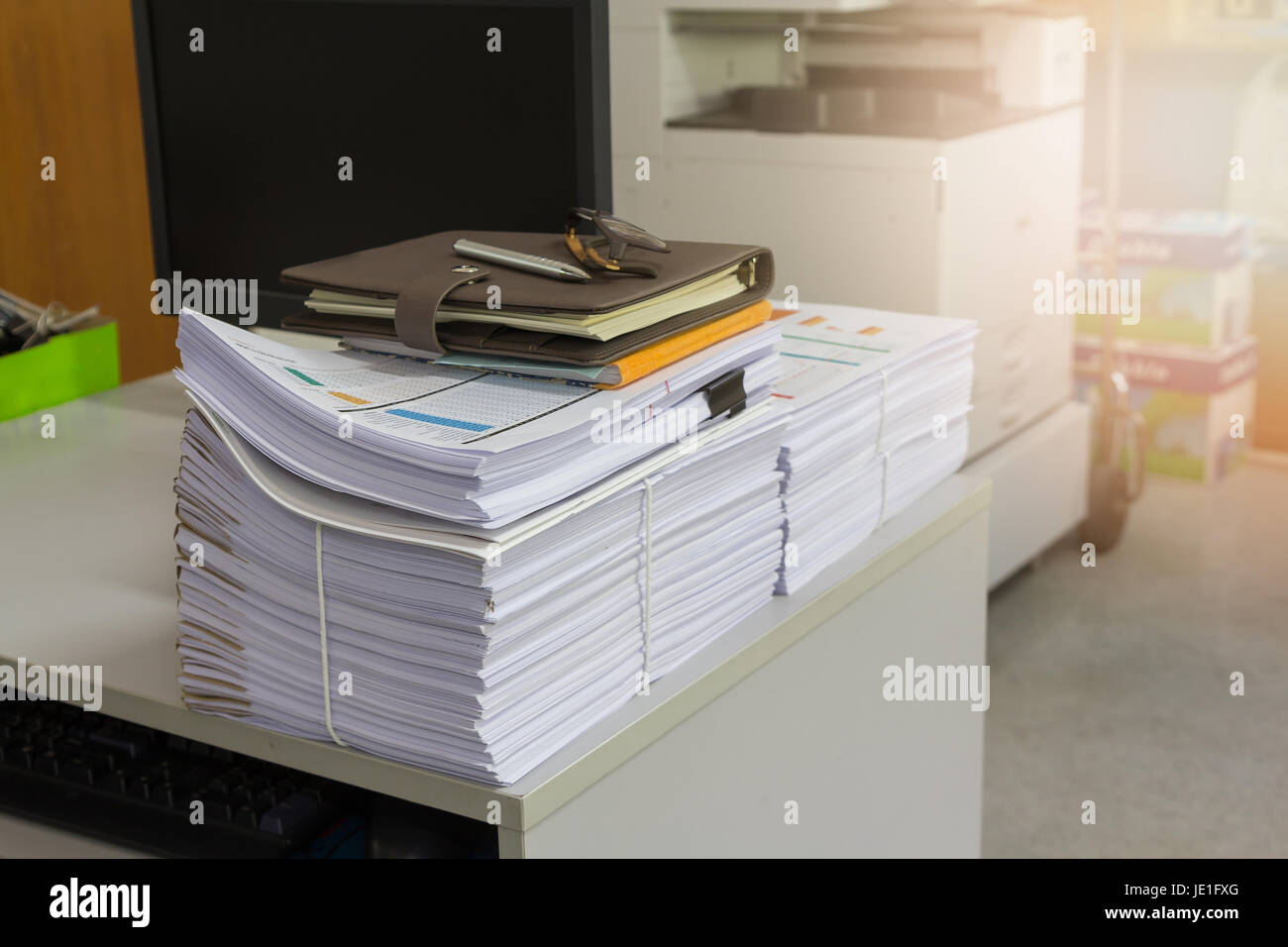 Pile of unfinished documents on office desk, Stack of business paper ...
