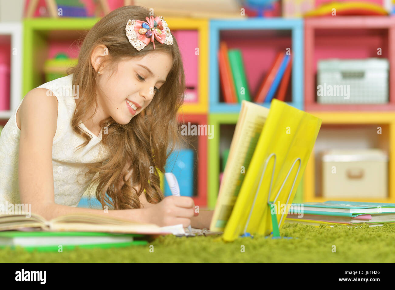 little cute girl doing homework at home Stock Photo - Alamy