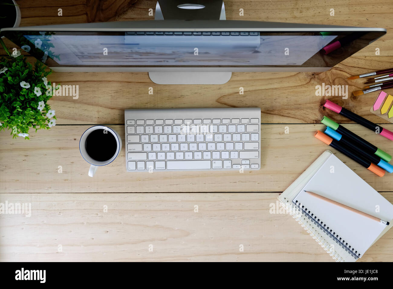 Workspace modern desktop computer on wood table and office stuff. top ...