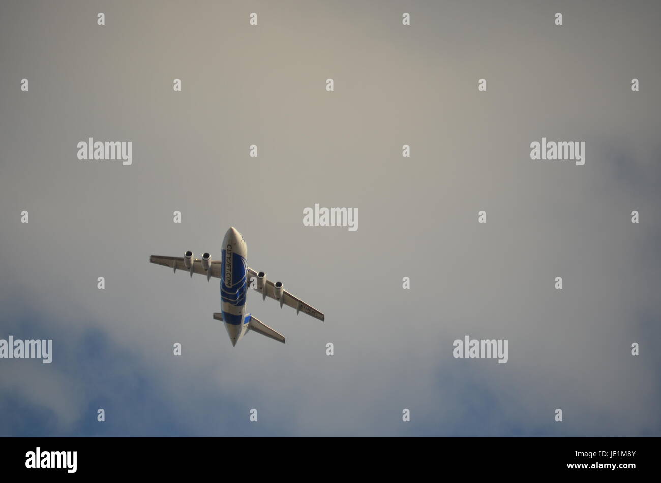 Blue and White Commercial Airplane Flying Upwards Stock Photo - Alamy