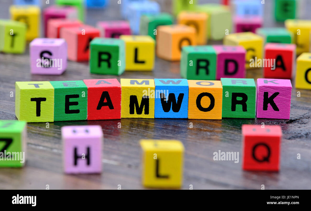 The word Teamwork on wooden table Stock Photo - Alamy
