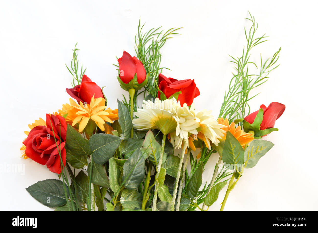 Bouquet of red roses and daisies on white background Stock Photo - Alamy