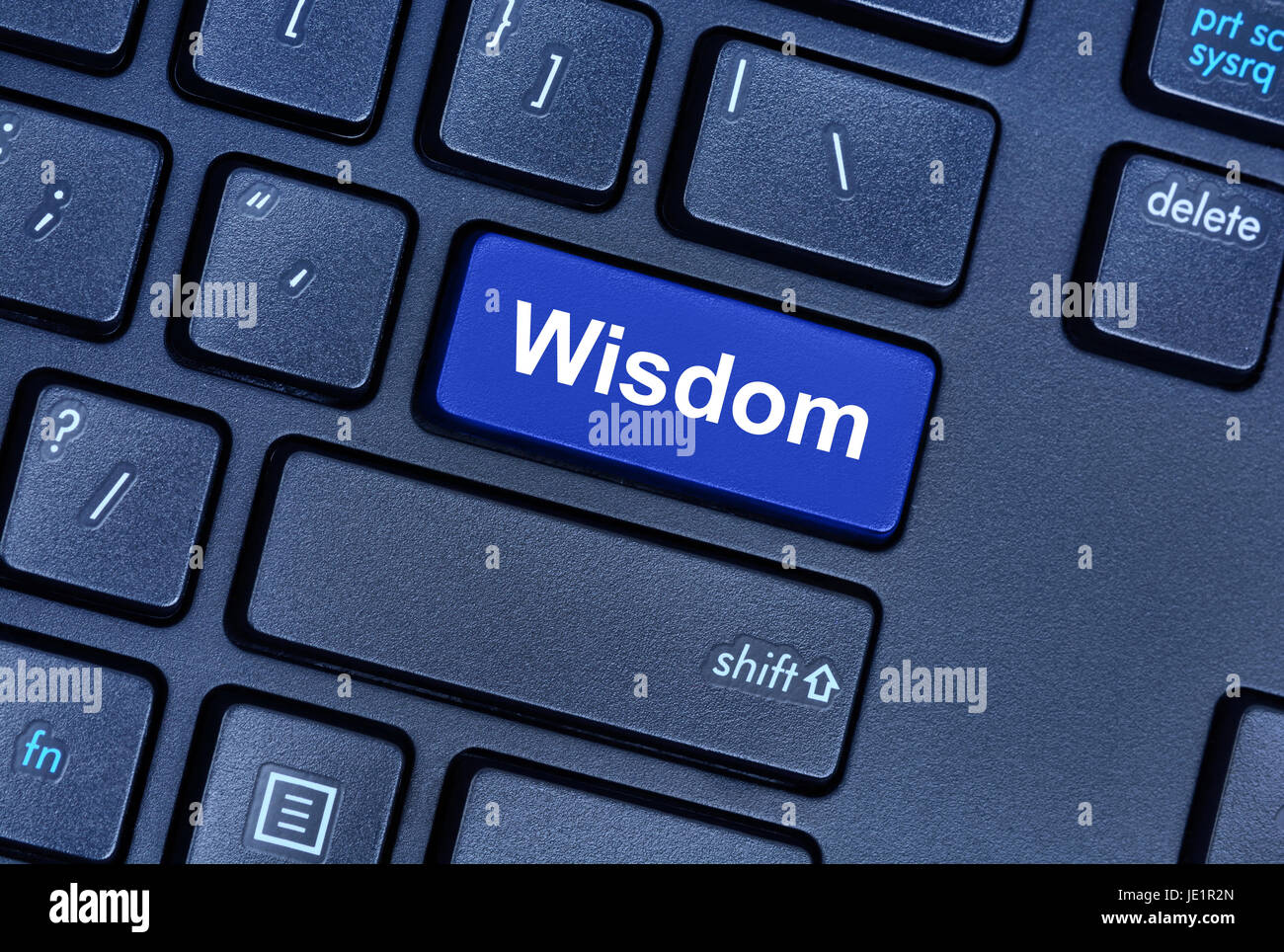 Wisdom word on computer keyboard button closeup Stock Photo - Alamy