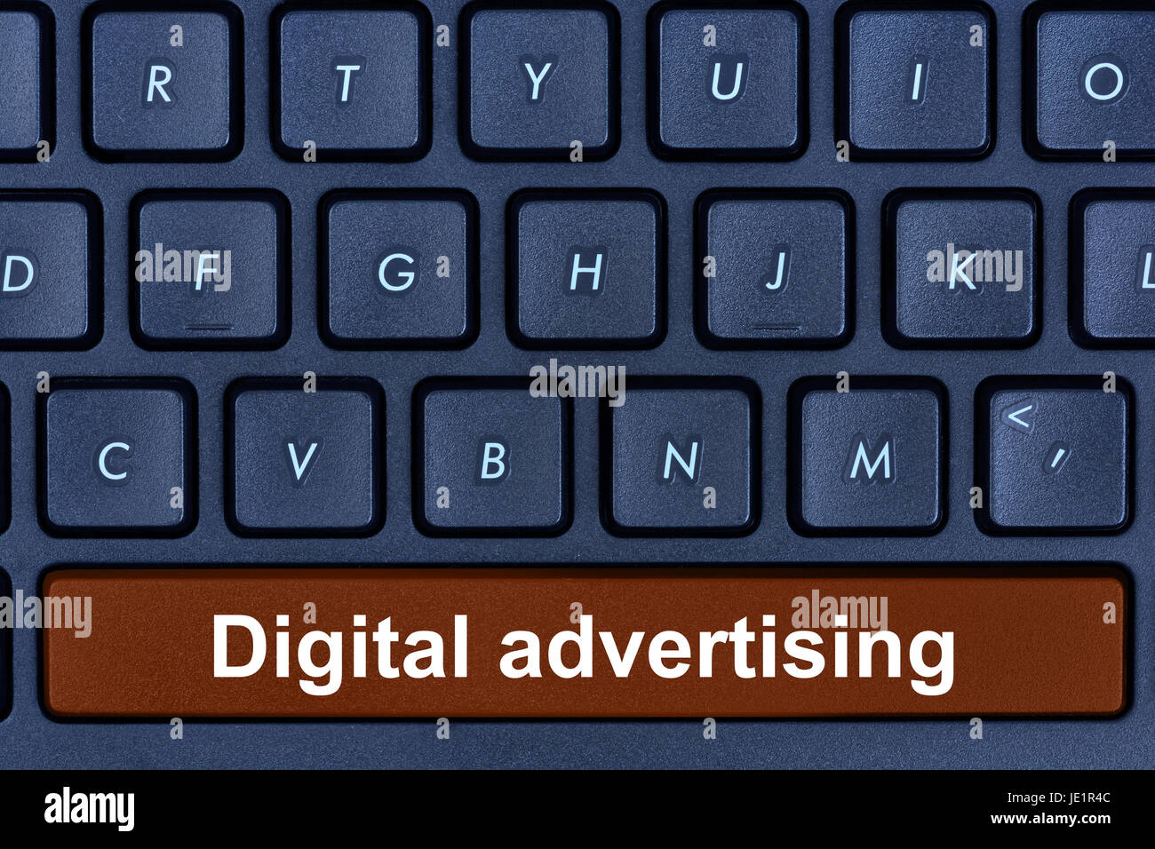 Digital advertising words on computer keyboard button closeup Stock ...