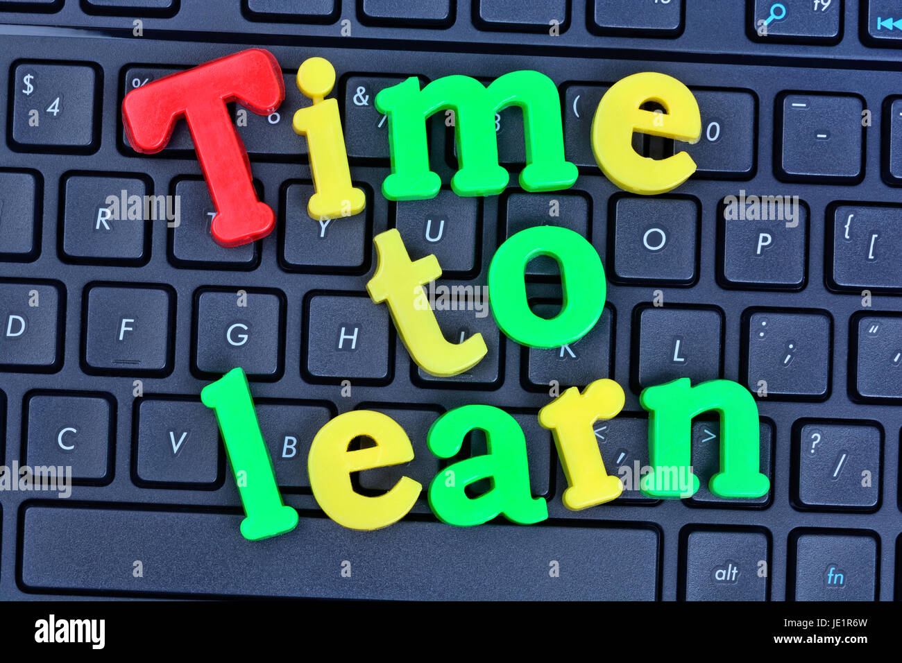 Time to learn words on computer keyboard closeup Stock Photo - Alamy