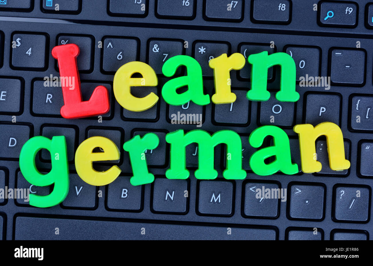 Learn german words on computer keyboard closeup Stock Photo - Alamy
