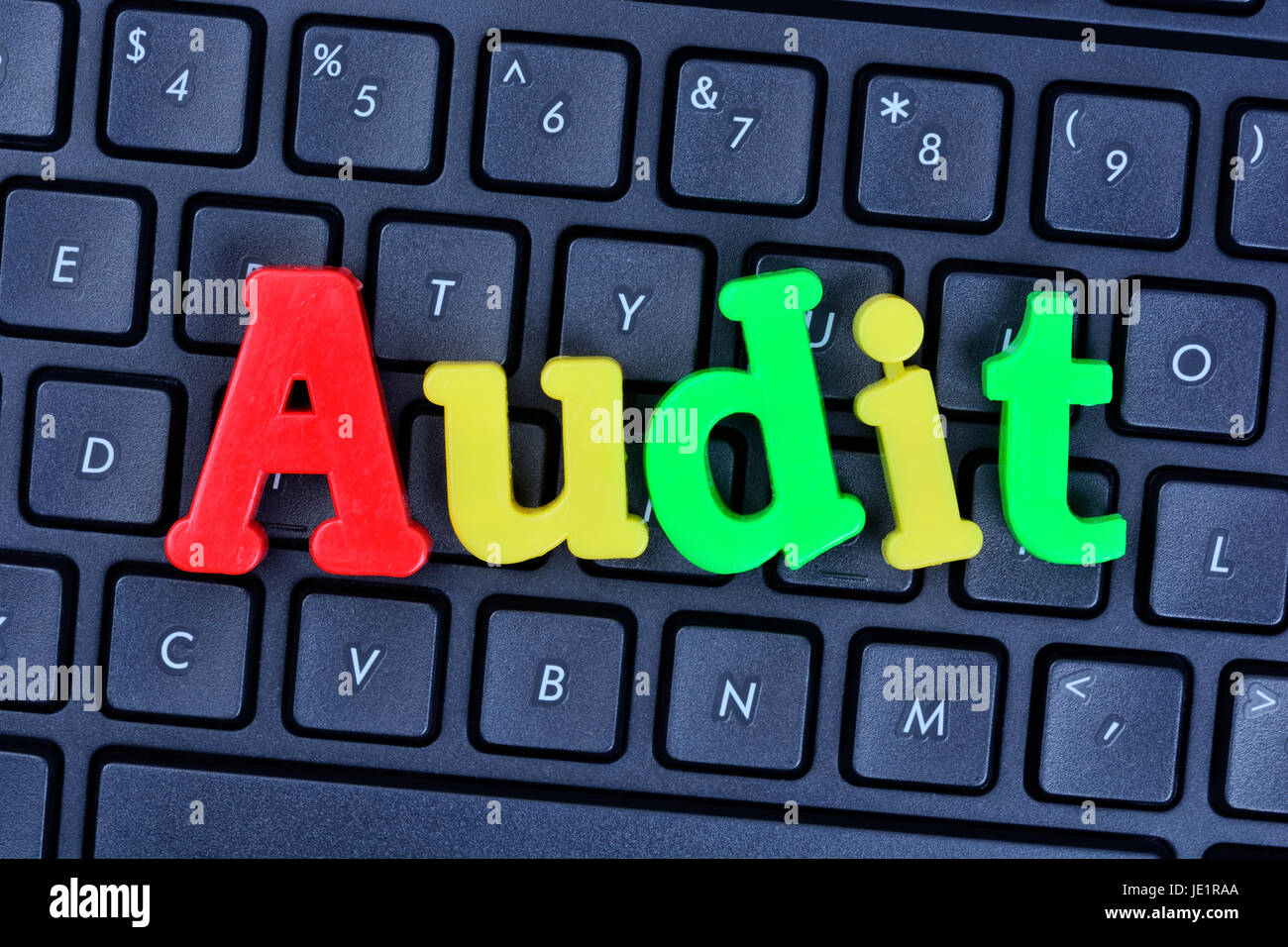 Audit word on computer keyboard closeup Stock Photo - Alamy