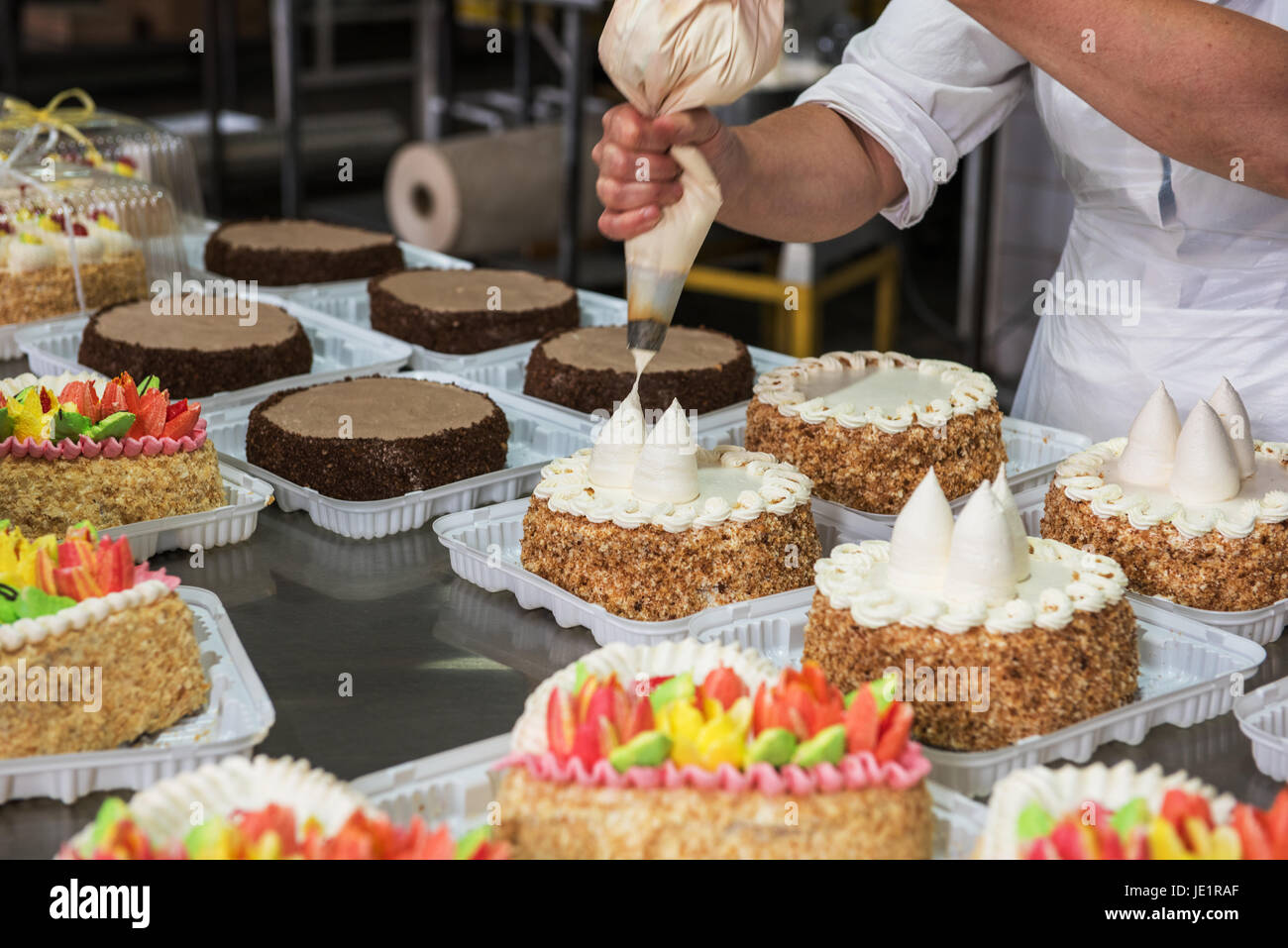 Manual cakes production Stock Photo - Alamy