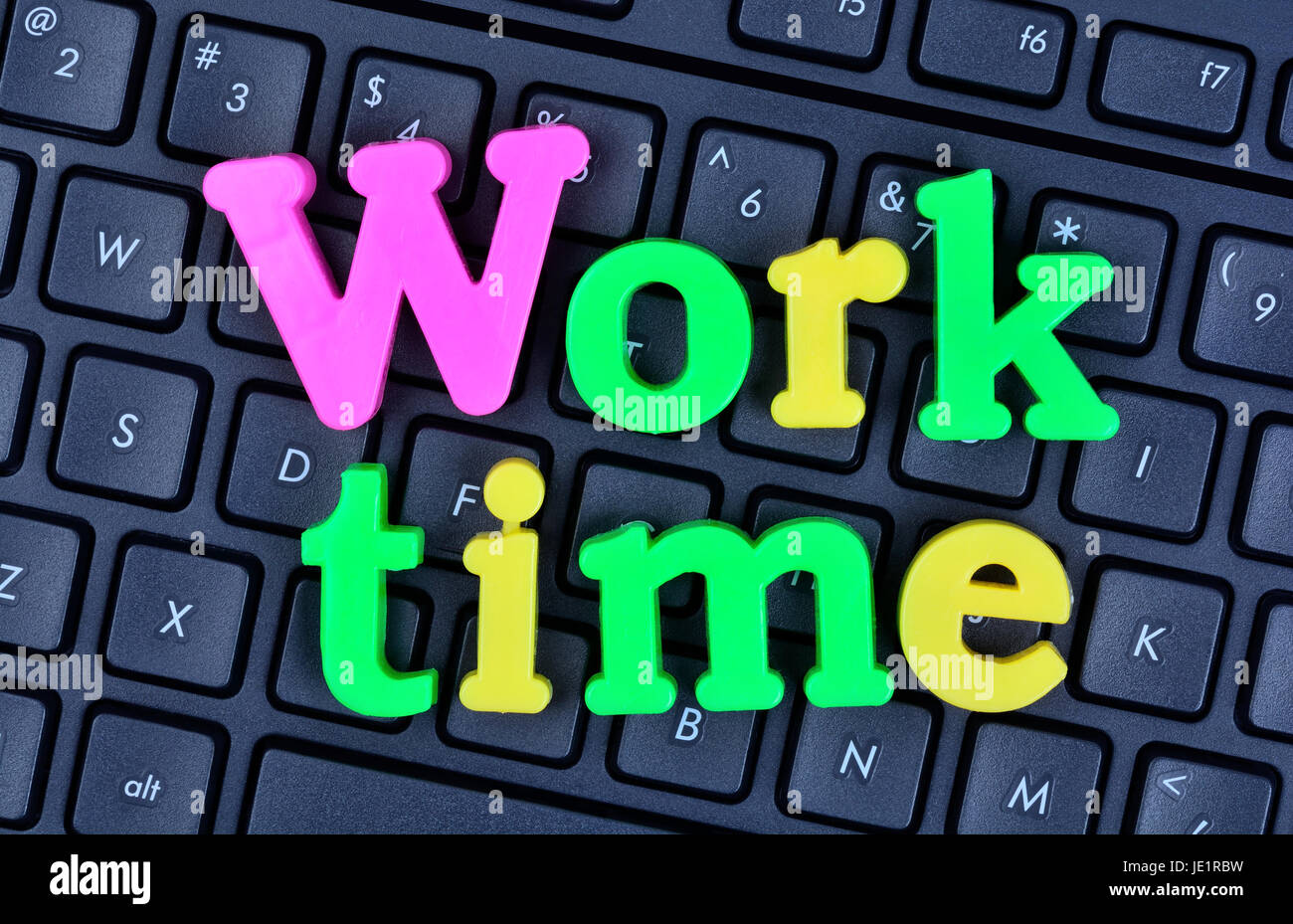 Work time words on computer keyboard closeup Stock Photo - Alamy