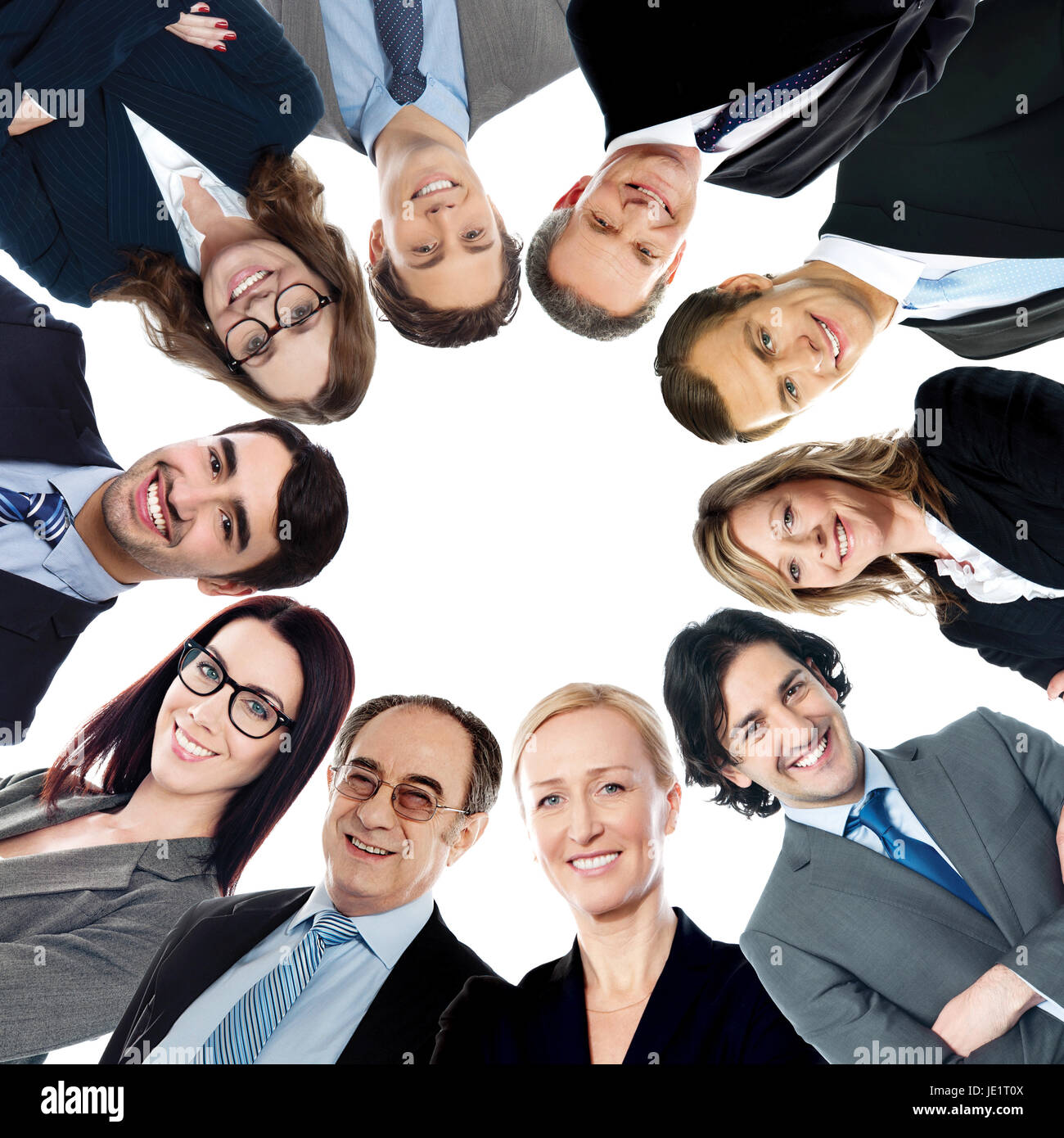 Circular formation of smiling business people Stock Photo - Alamy