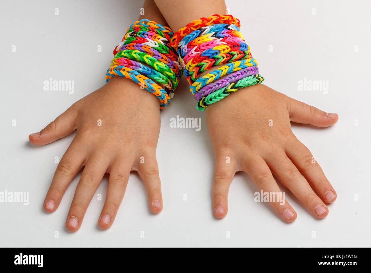 Loom bracelets on a young kid's hand Stock Photo - Alamy