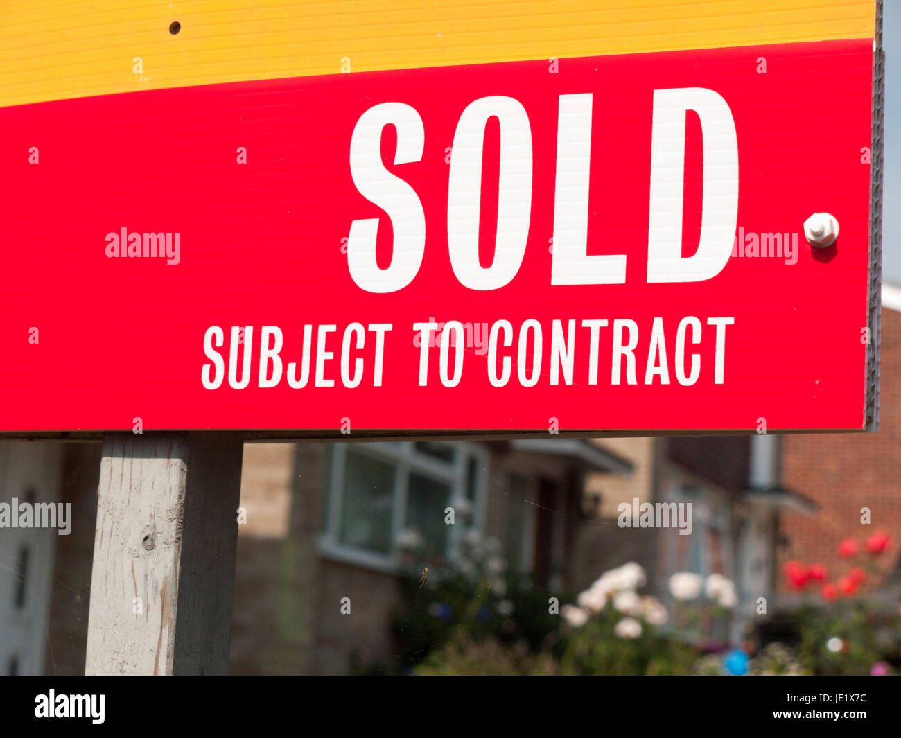 red sold subject to contract sign outside in garden of house Stock ...