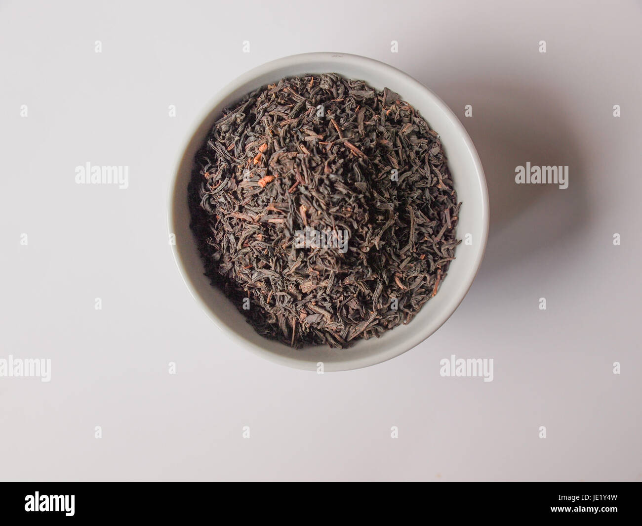 Loose tea leaves in a small bowl Stock Photo - Alamy