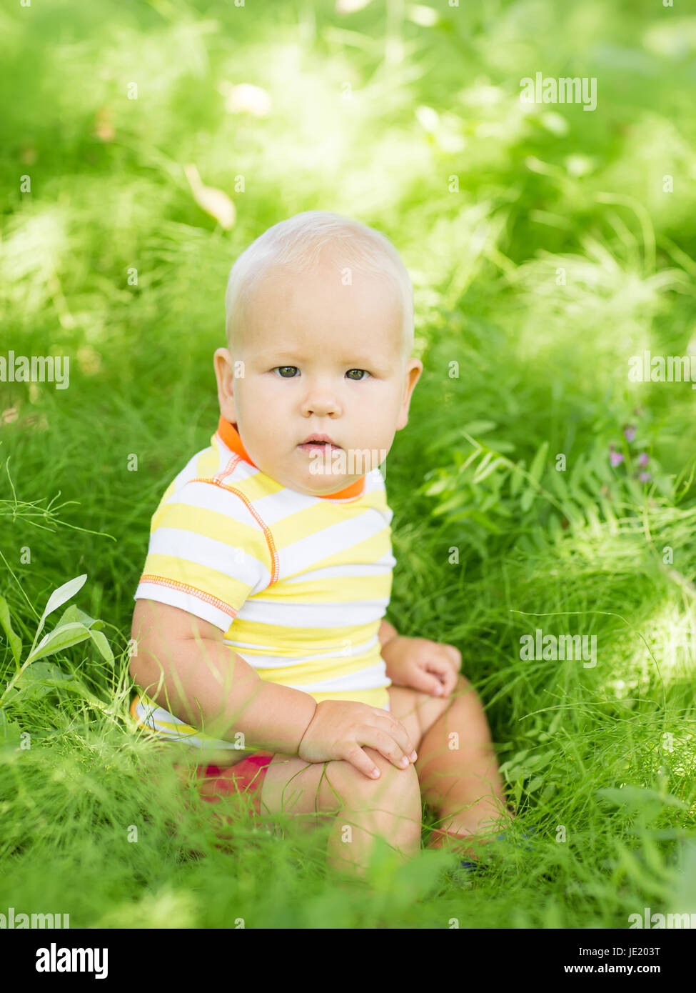 Adorable baby on green grass Stock Photo - Alamy