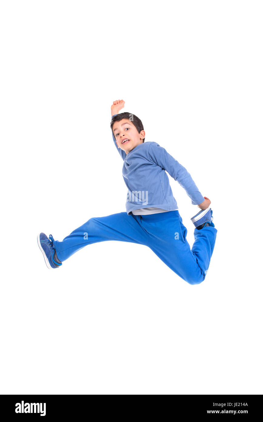 Young boy jumping isolated in white Stock Photo - Alamy