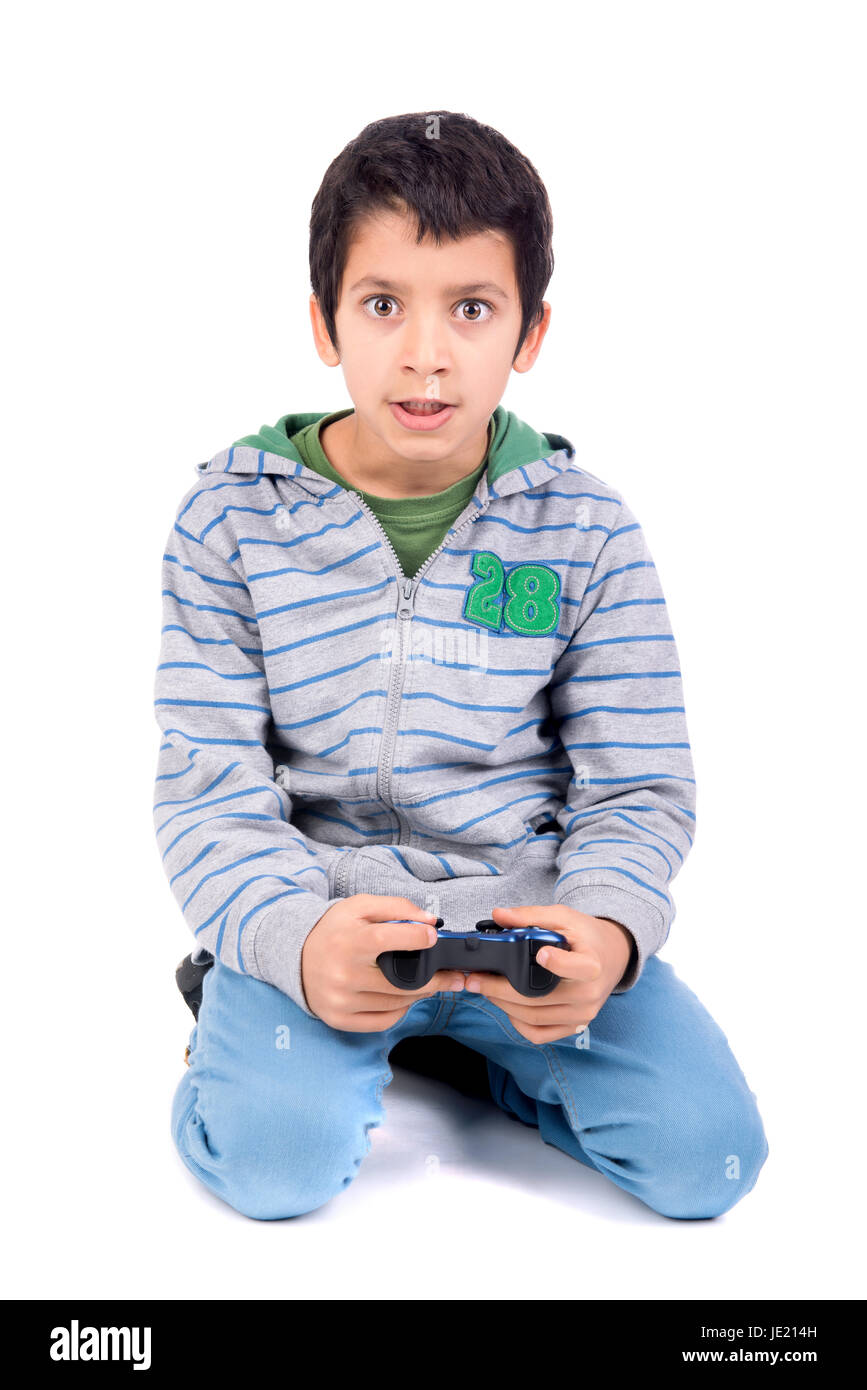 Boy playing video games making faces isolated in white Stock Photo - Alamy