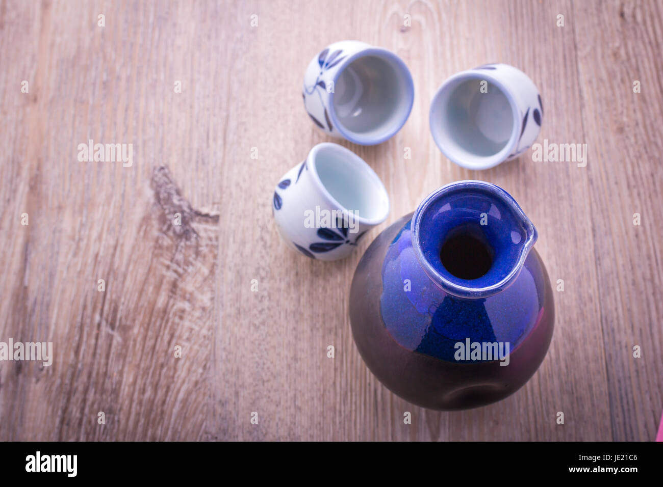 Japanese Sake drinking set on old wood texture background (focus on ...