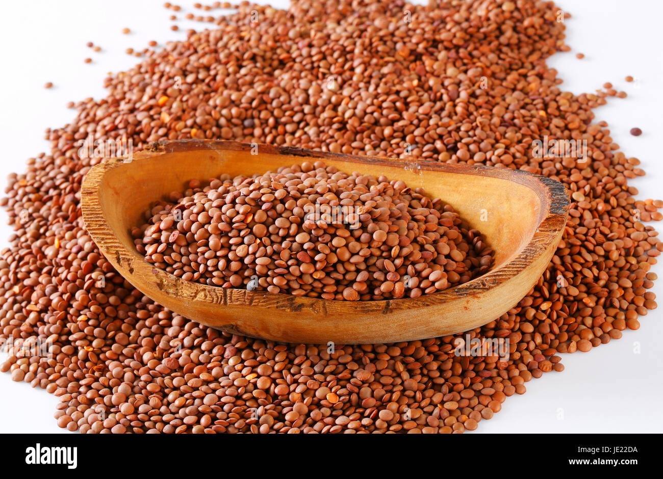 Whole red lentils in natural edge bowl Stock Photo - Alamy
