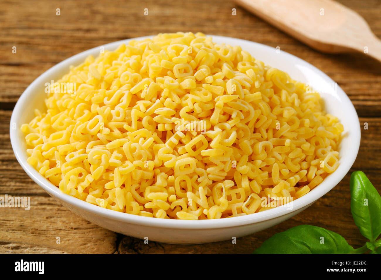 Plate of small letter-shaped pasta Stock Photo - Alamy