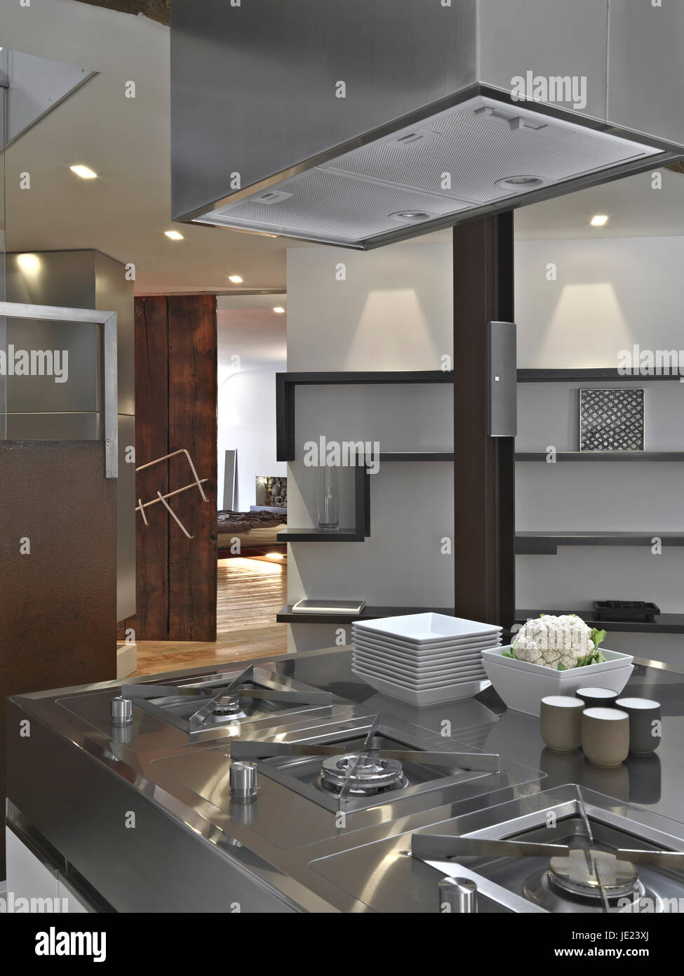 interior view of a modern kitchen with pile of dishes on the steel ...