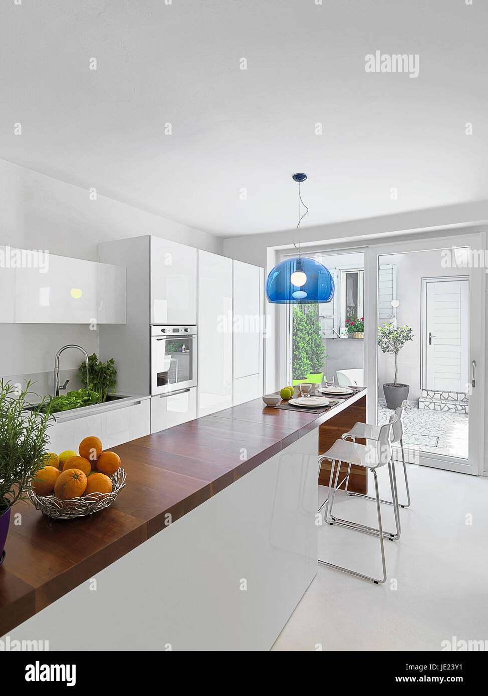 interior view of modern kitchen with kitchen island overlookig on the ...