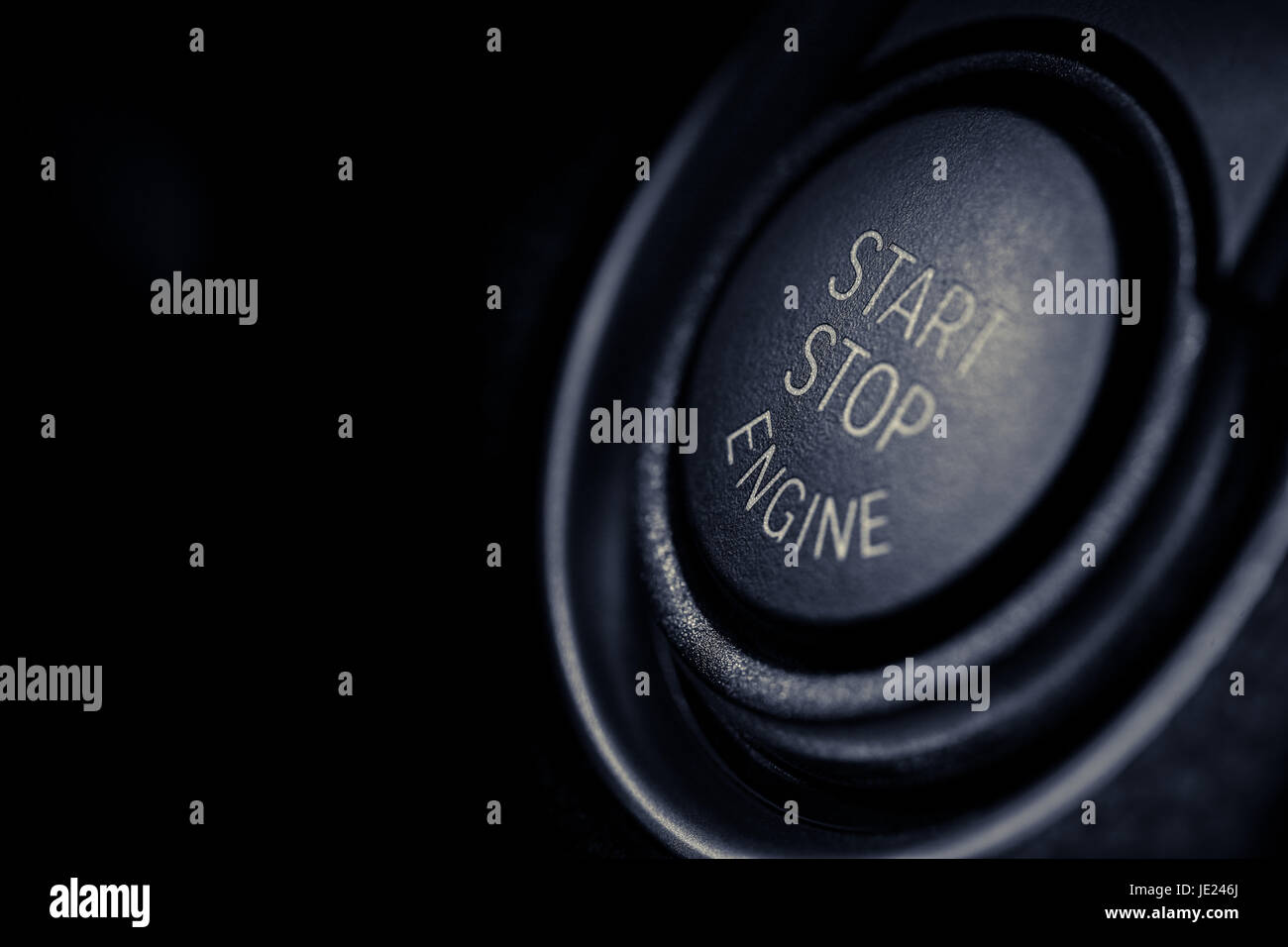 Detail on a black start button in a car Stock Photo - Alamy