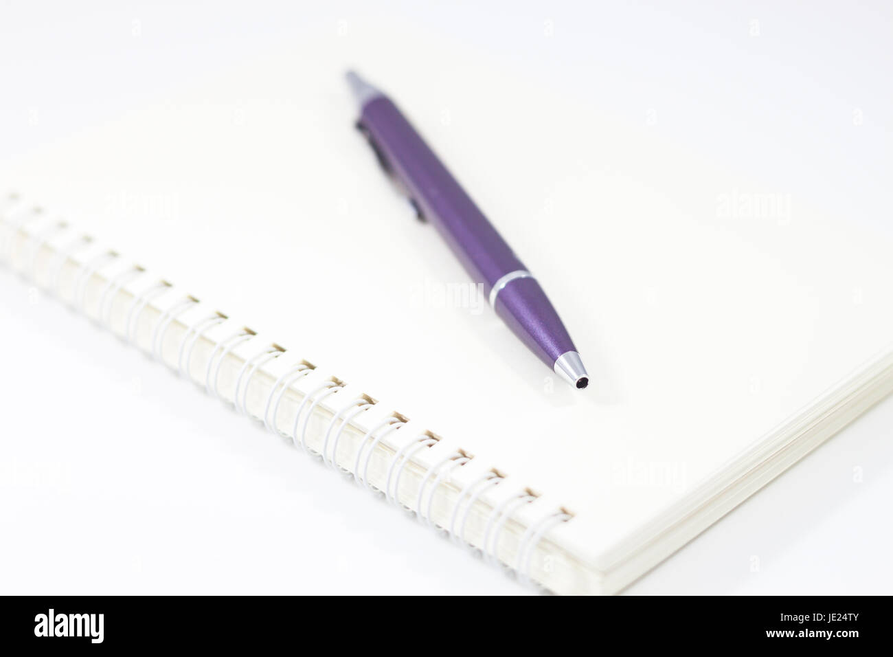 Spiral notebook and pen isolated on white background, stock photo Stock ...