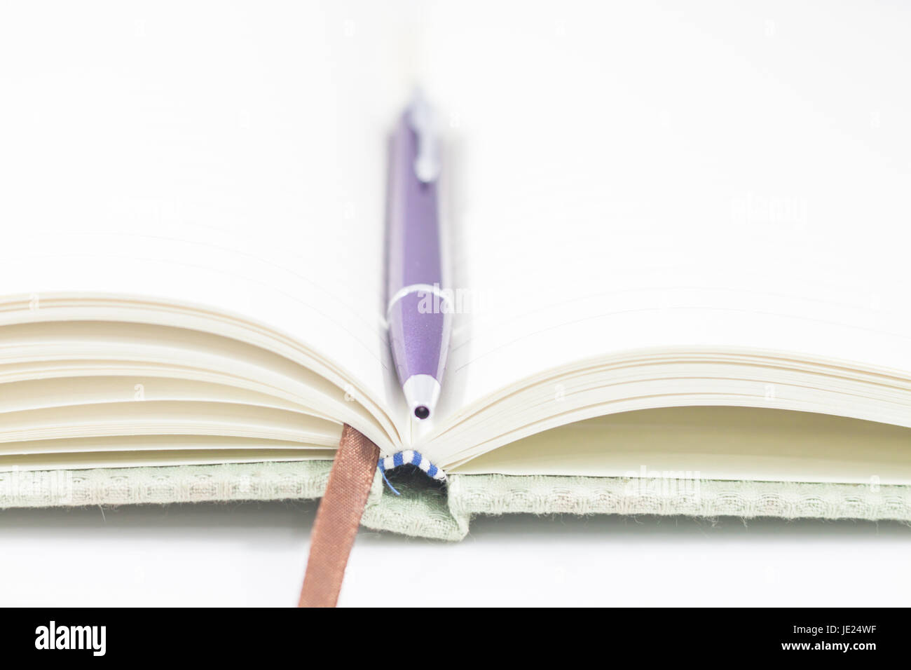 Closeup opened notebook and pen on white background, stock photo Stock ...