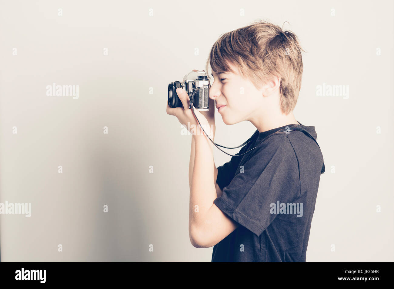little boy with vintage reflex camera - filtered retro style Stock ...