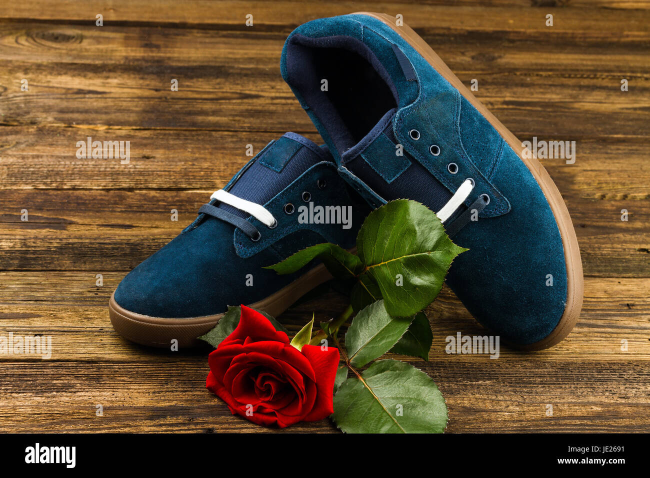 dark blue man's shoes and rose on wooden background Stock Photo - Alamy