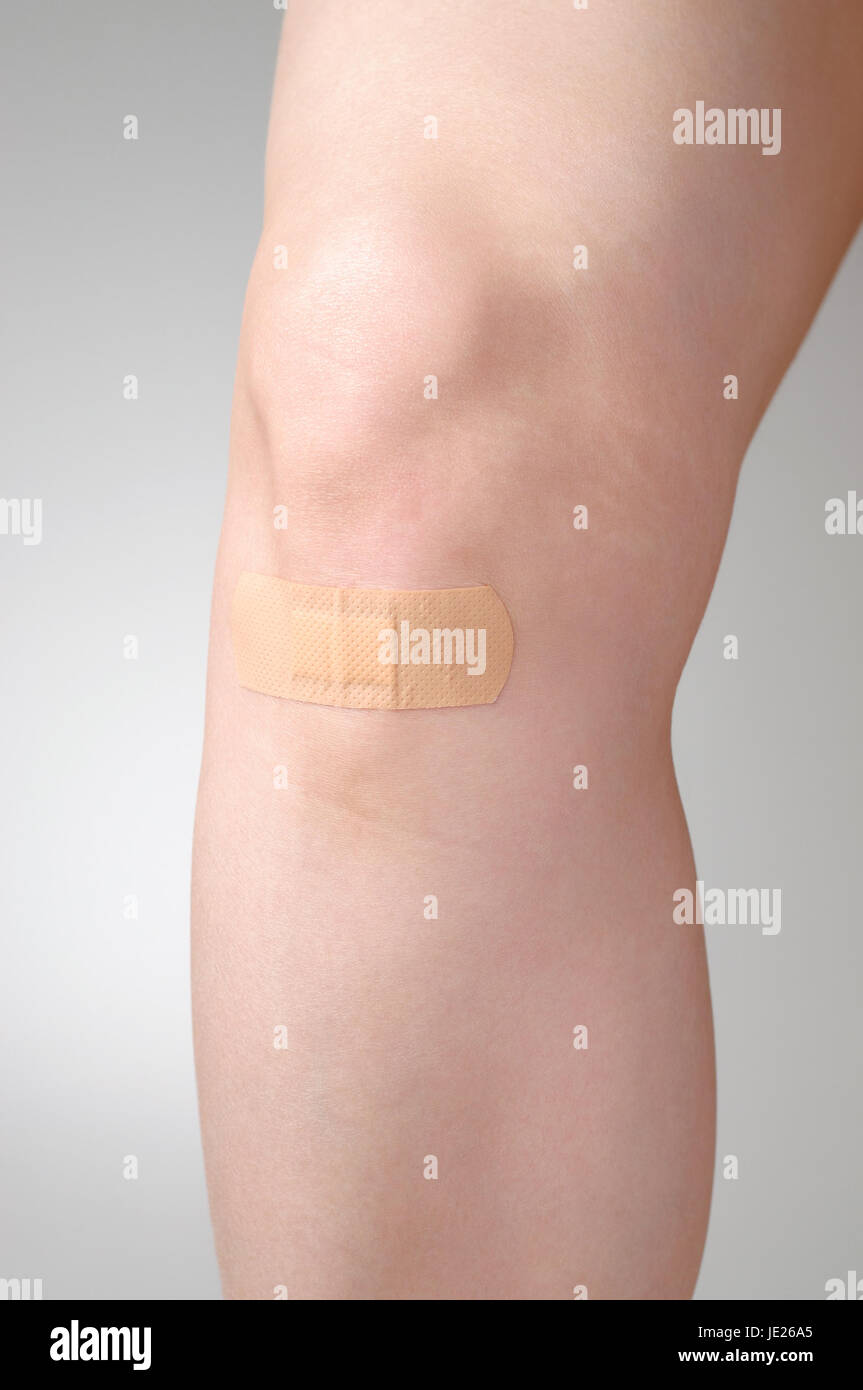 Female leg with adhesive bandage Stock Photo - Alamy