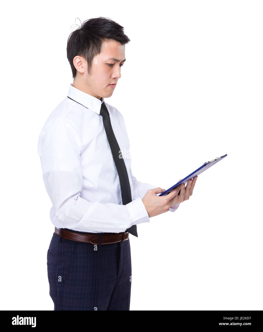 Businessman read on clipboard Stock Photo - Alamy