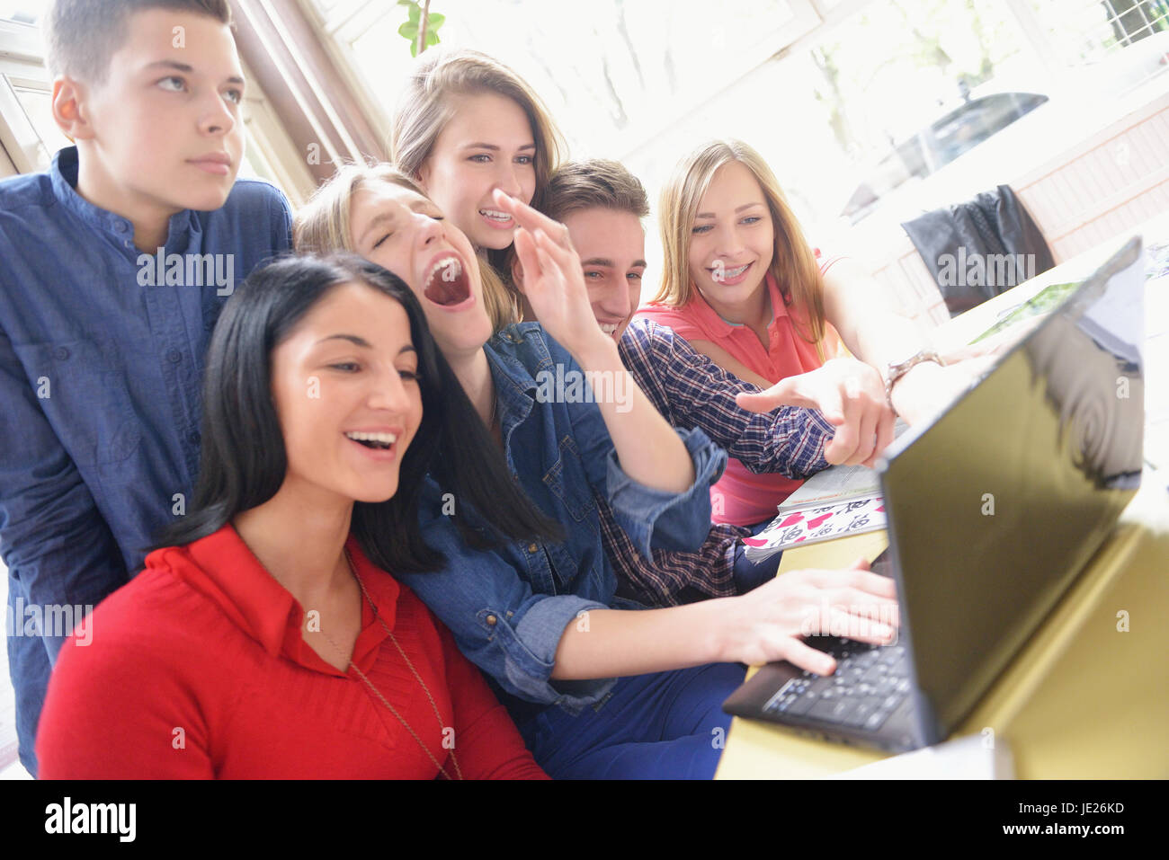 happy young teens group in school have fun an learning lessons Stock ...