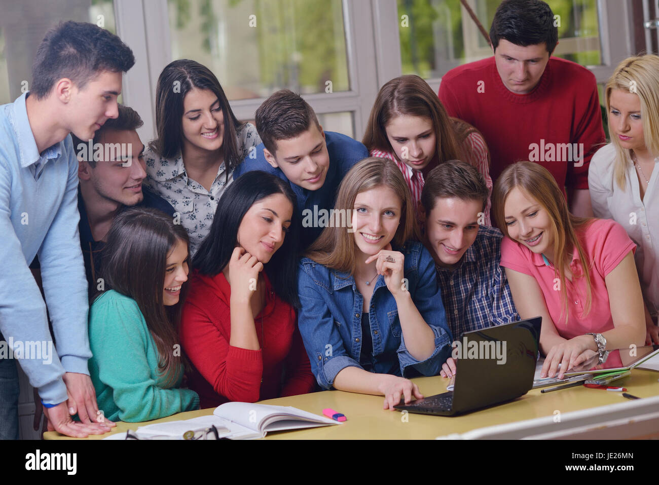 happy young teens group in school have fun an learning lessons Stock ...