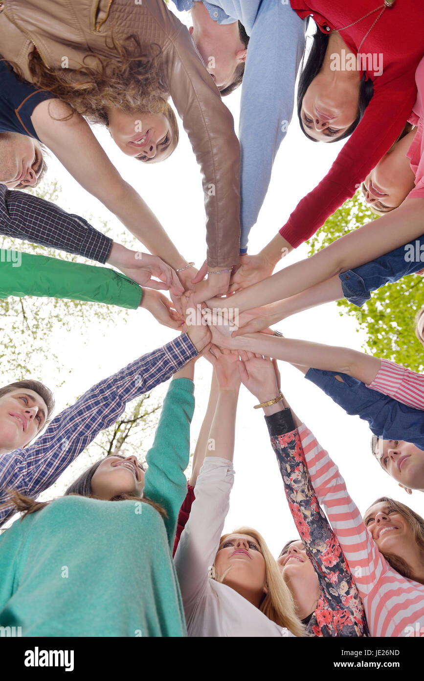 Happy smiling group of young friends staying together outdoor in the ...