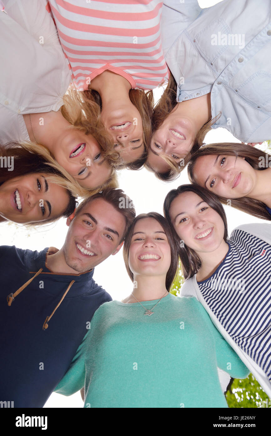 Happy smiling group of young friends staying together outdoor in the ...