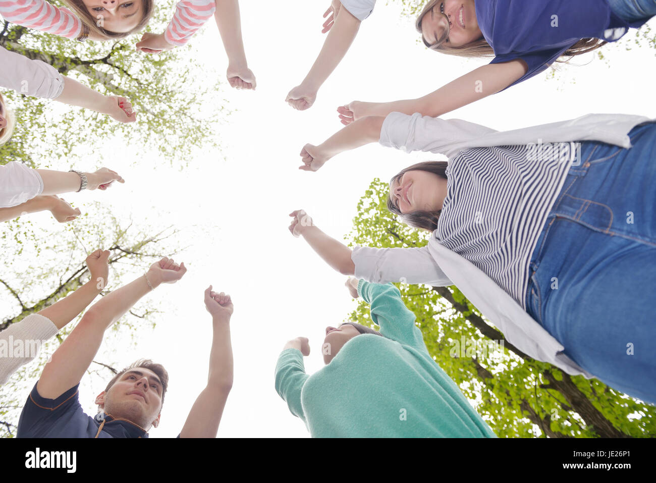 Happy smiling group of young friends staying together outdoor in the ...