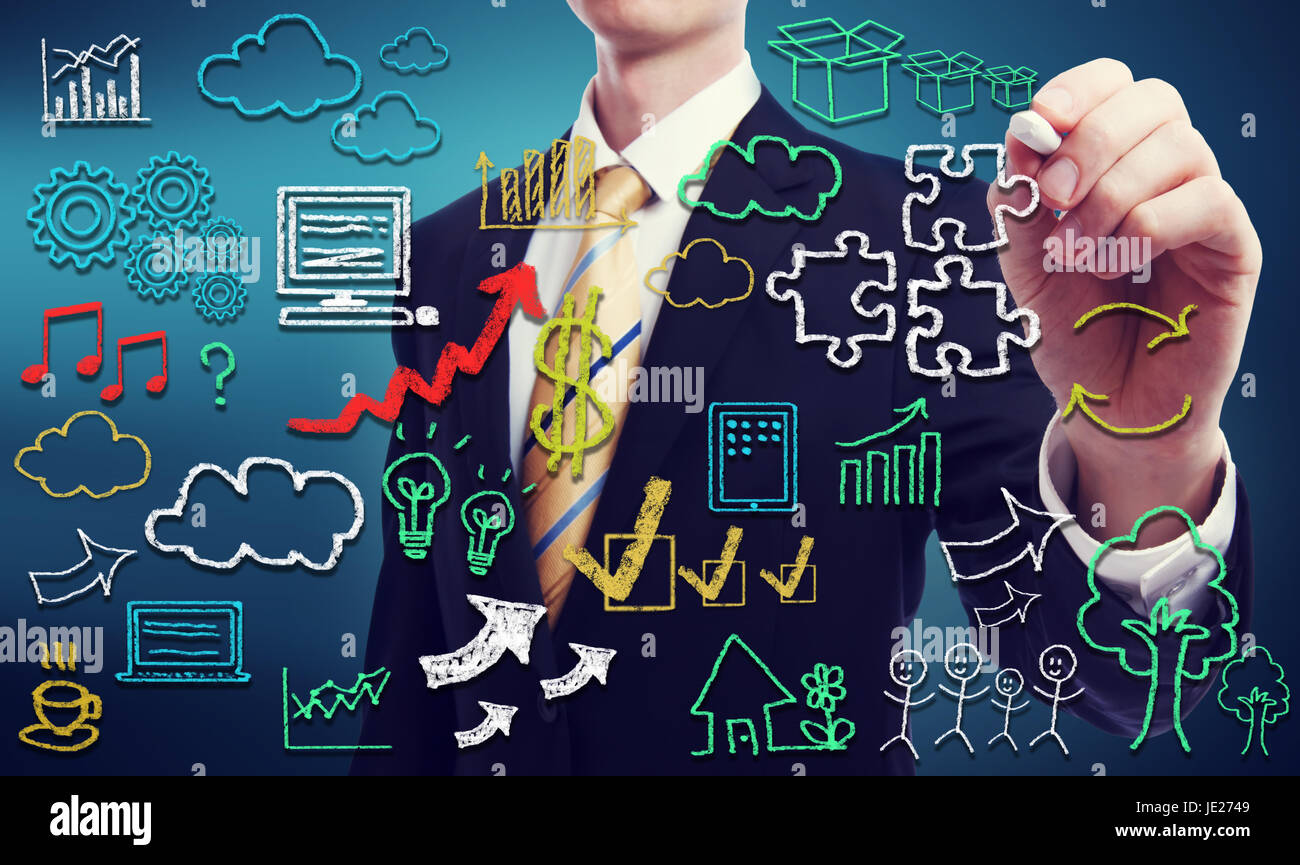 Businessman with hand written cloud computing themed texts and pictures ...