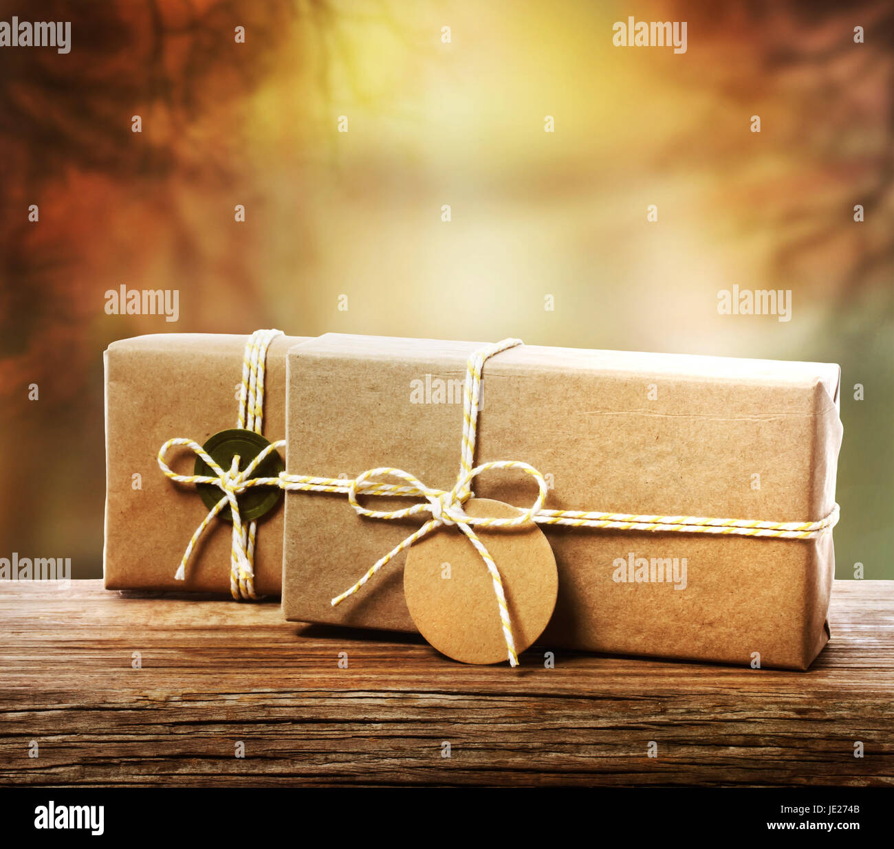 Handcrafted gift boxes with an autumn tree branch background Stock ...