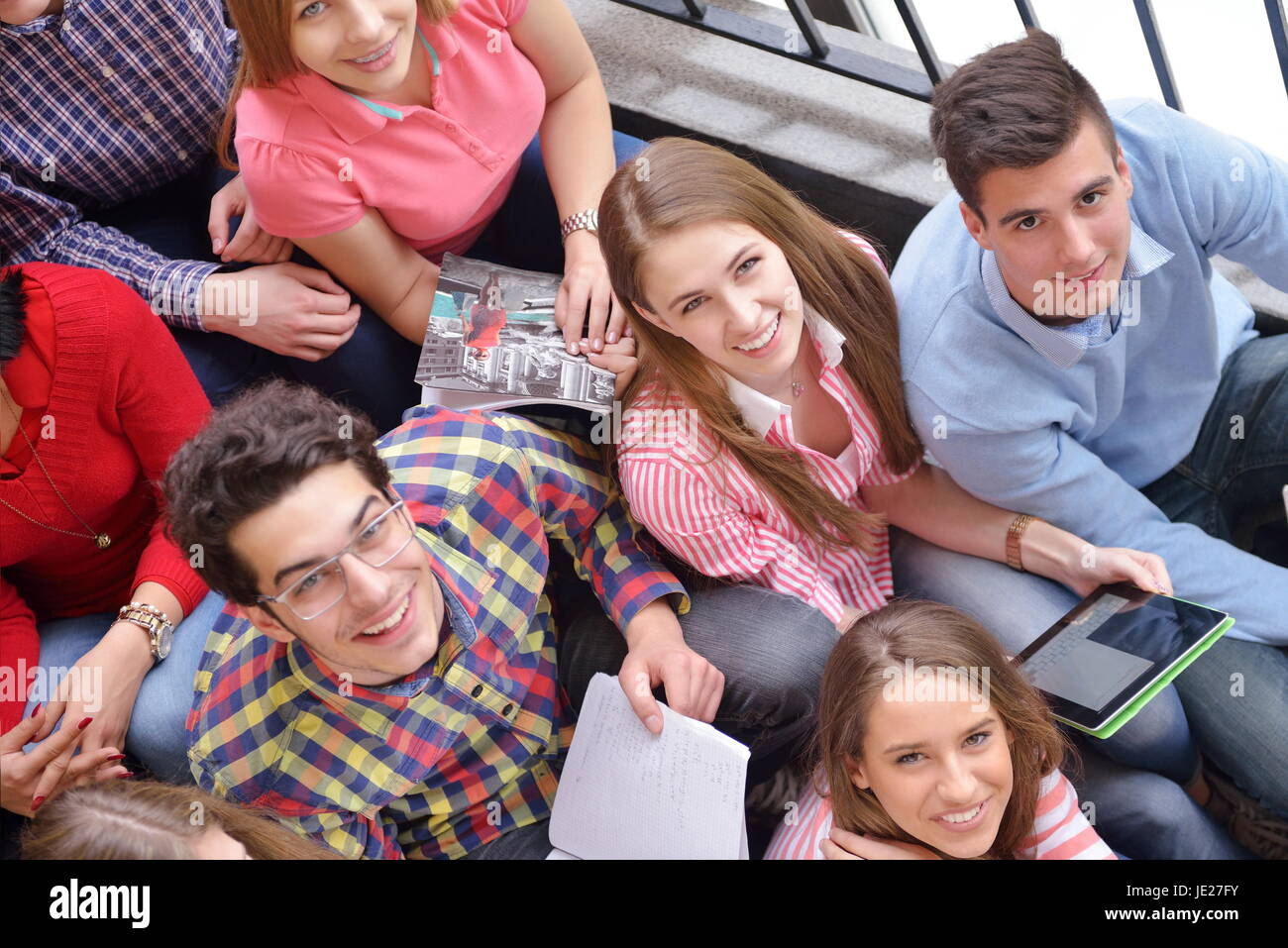 happy young teens group in school have fun an learning lessons Stock ...