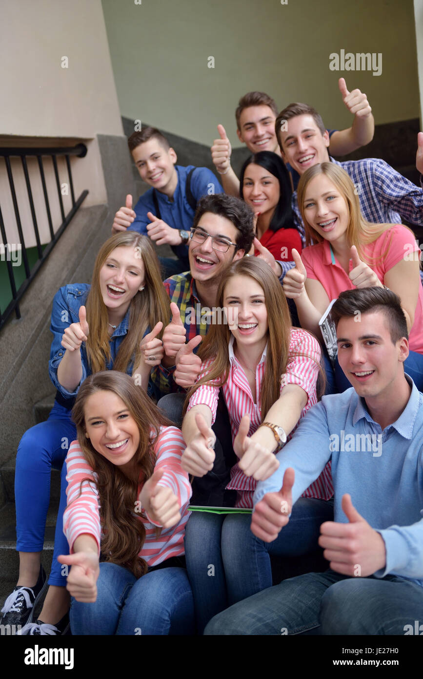 happy young teens group in school have fun an learning lessons Stock ...