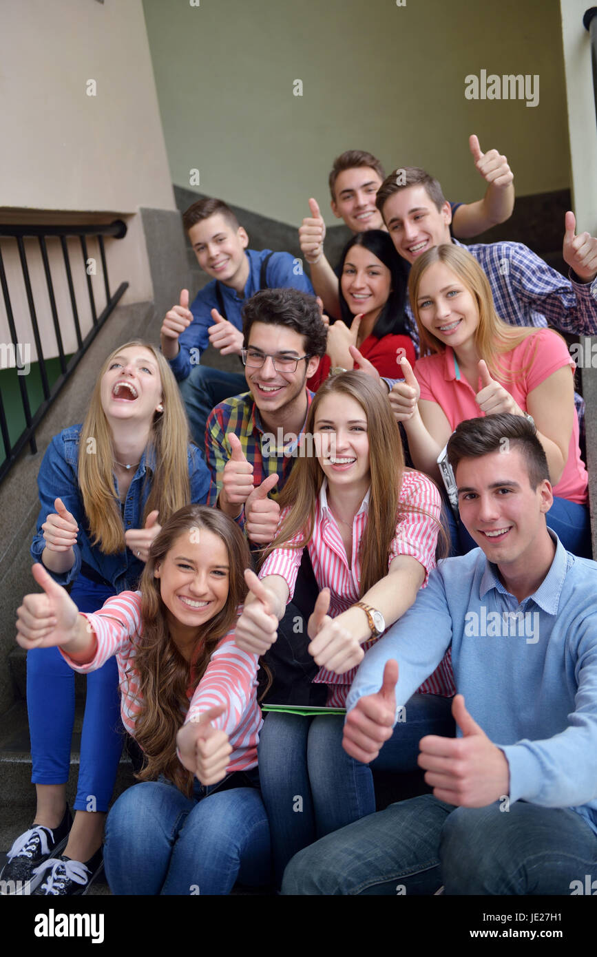 happy young teens group in school have fun an learning lessons Stock ...