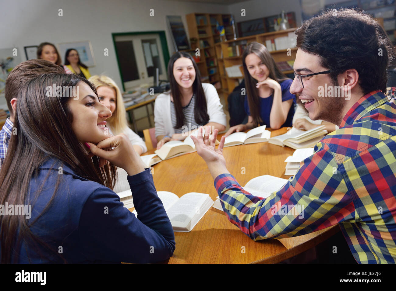 happy young teens group in school have fun an learning lessons Stock ...