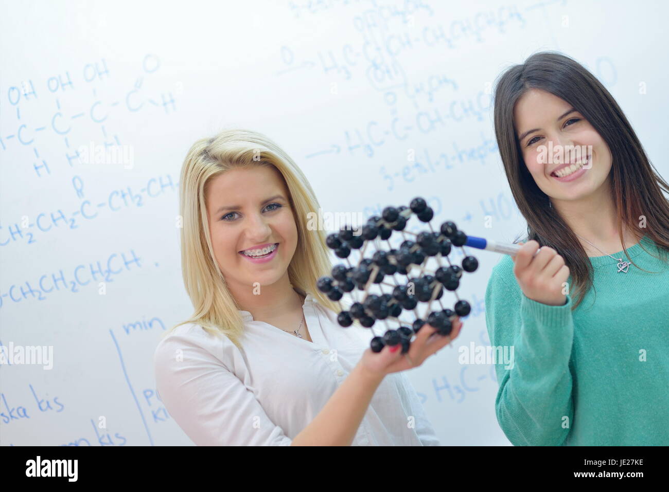 happy young teens group in school have fun an learning lessons Stock ...