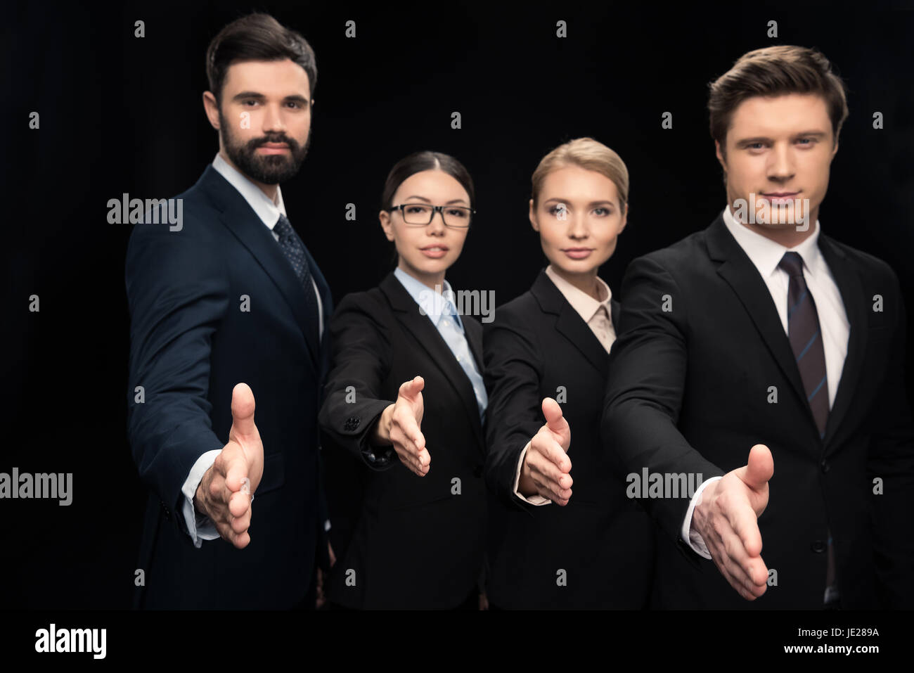 Team work hands black hi-res stock photography and images - Alamy