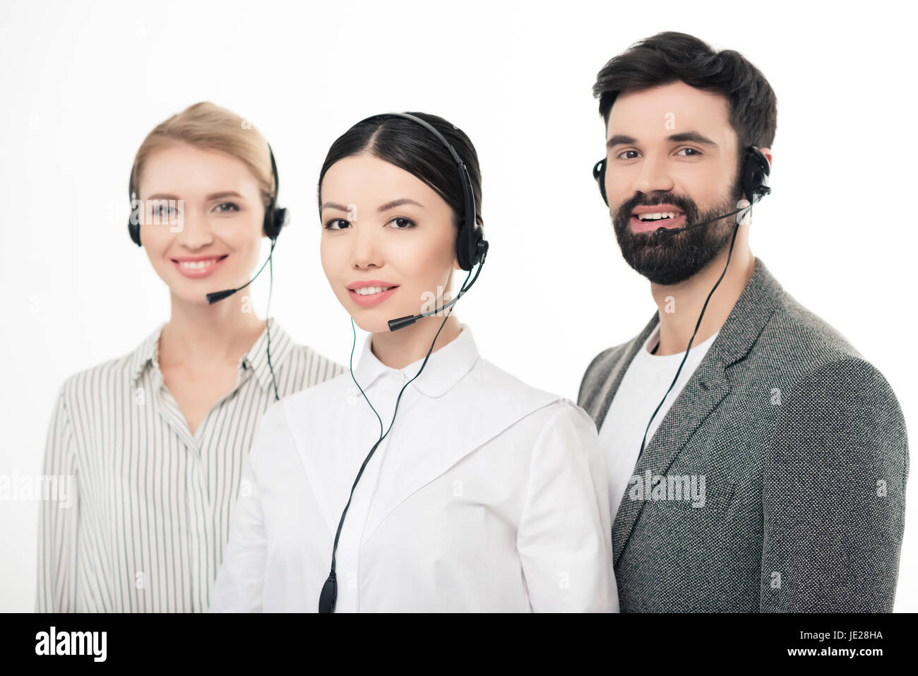 portrait of smiling call center operators in headsets isolated on white Stock Photo - Alamy
