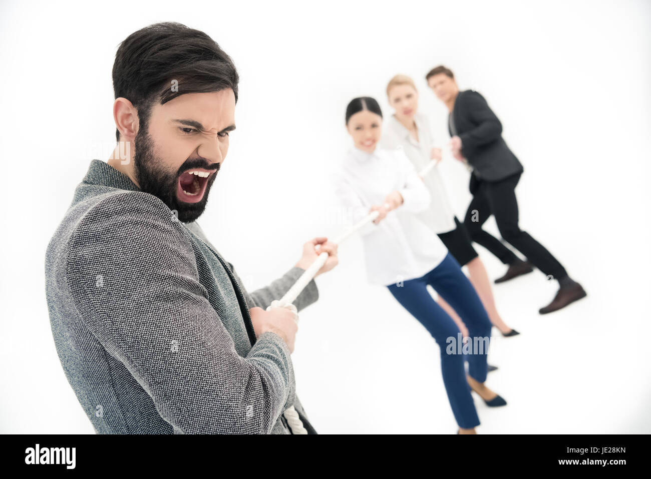group of business people pulling over rope isolated on white Stock ...