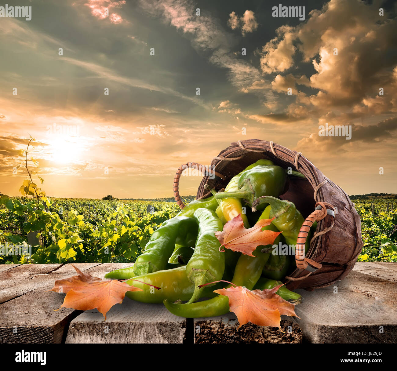 Pepper in a basket on table and landscape Stock Photo - Alamy
