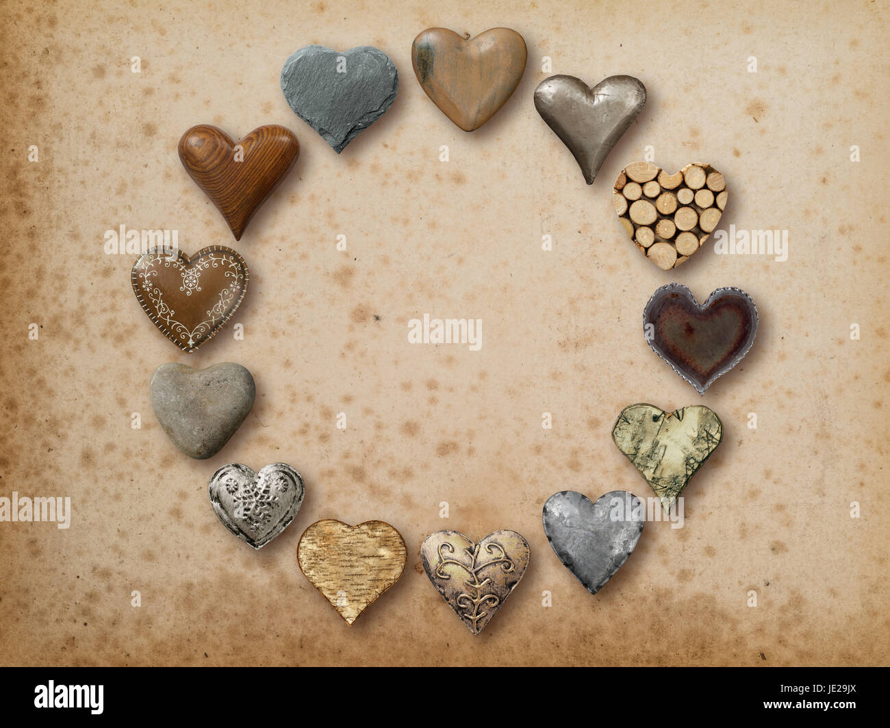 Photo of metal, wood and stone heart-shaped things organized in a ...